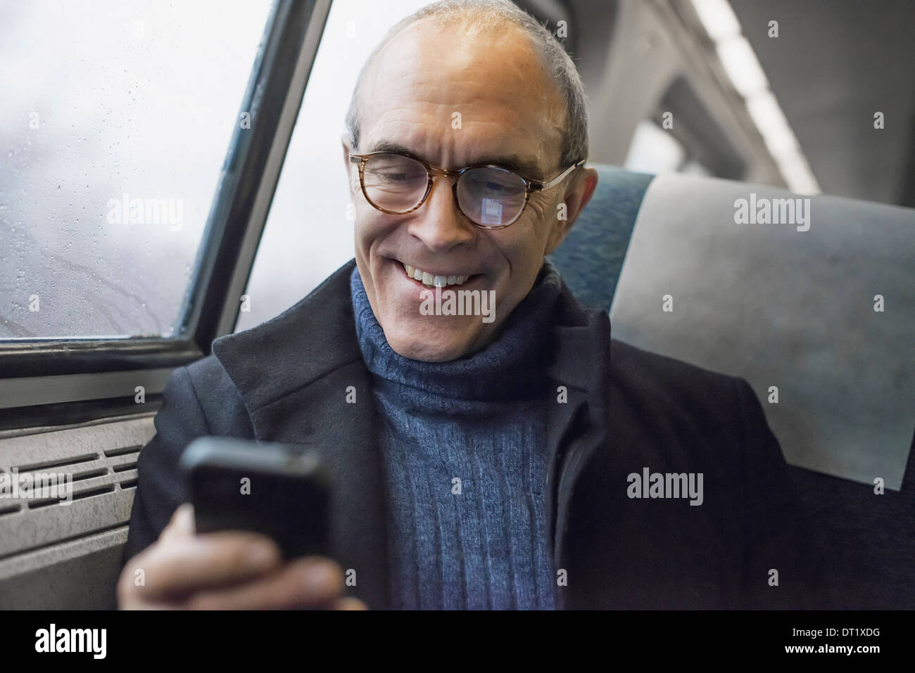 Man sitting on seat railway High Resolution Stock Photography and ...