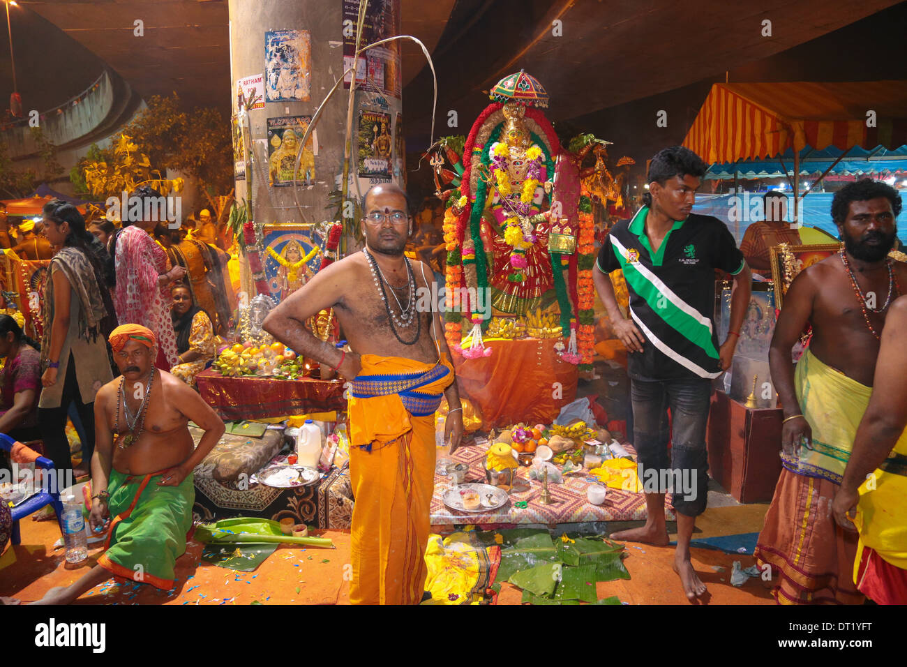 A hindu priest and his ritual altar during Thaipusam at Batu Cave ...