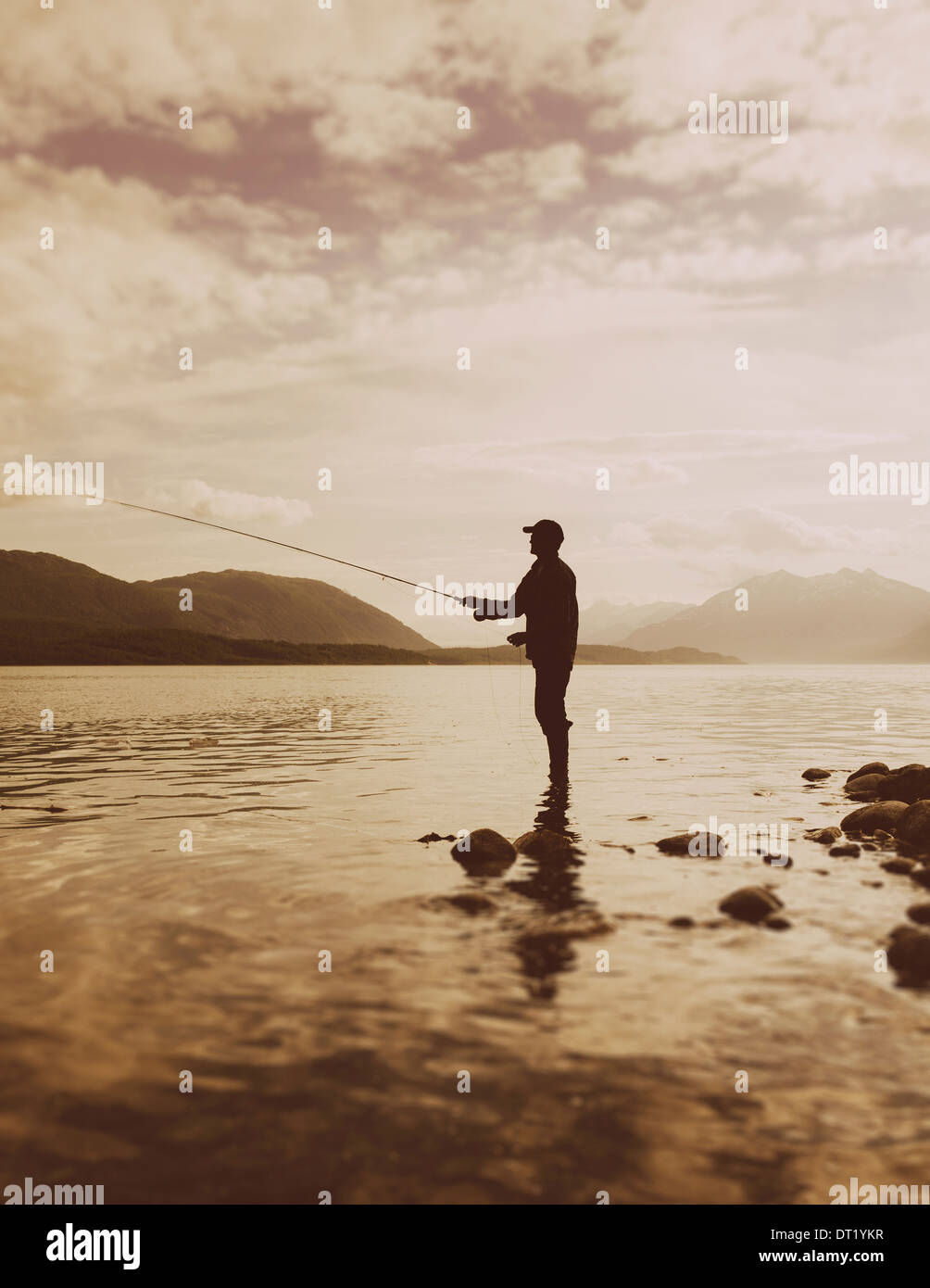 Silhouette of man fishing hi-res stock photography and images - Alamy