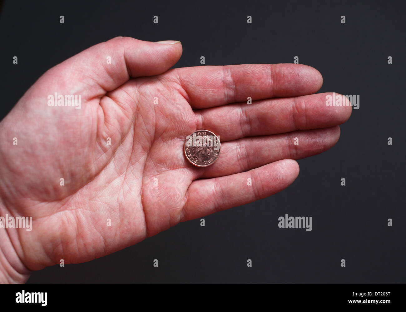 A penny in the palm of a man's hand Stock Photo - Alamy