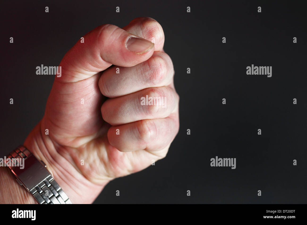 A man's clenched fist Stock Photo - Alamy