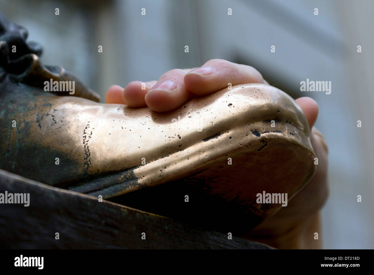 Hand touching the shoe of the statue of John Harvard, Boston, USA, to ...