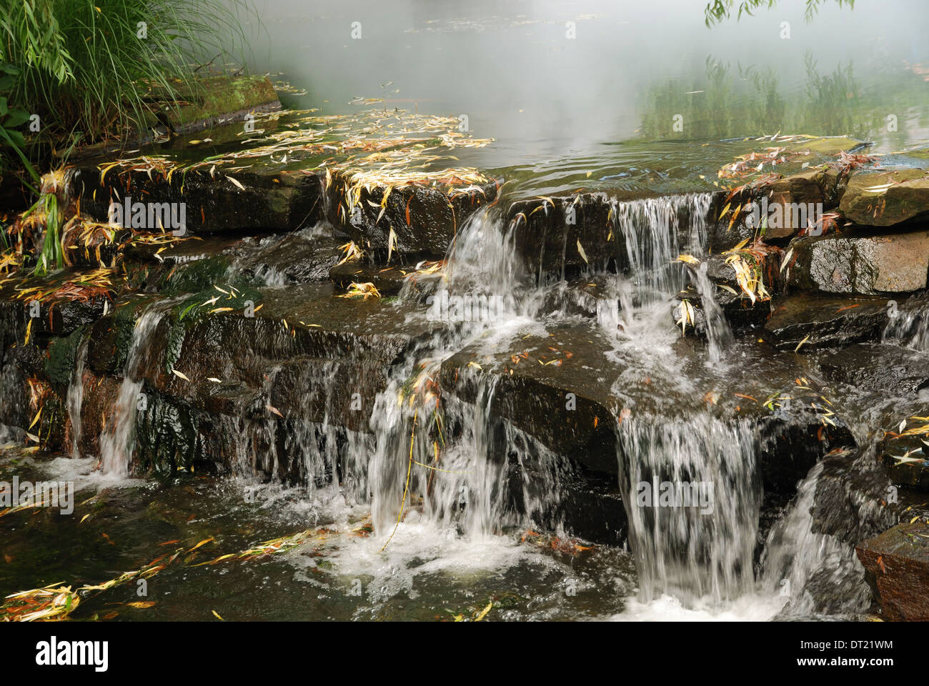Small artificial waterfall Stock Photo - Alamy
