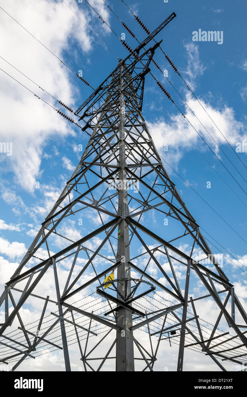 An electricity pylon/tower against a blue sky Stock Photo - Alamy