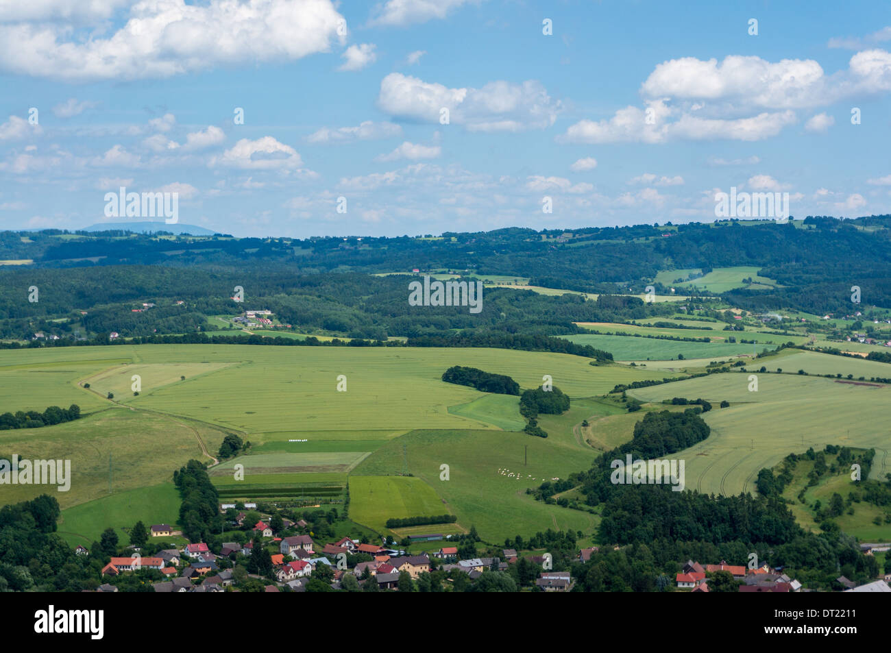 A high vantage point overlooking a valley with the horizon in the ...