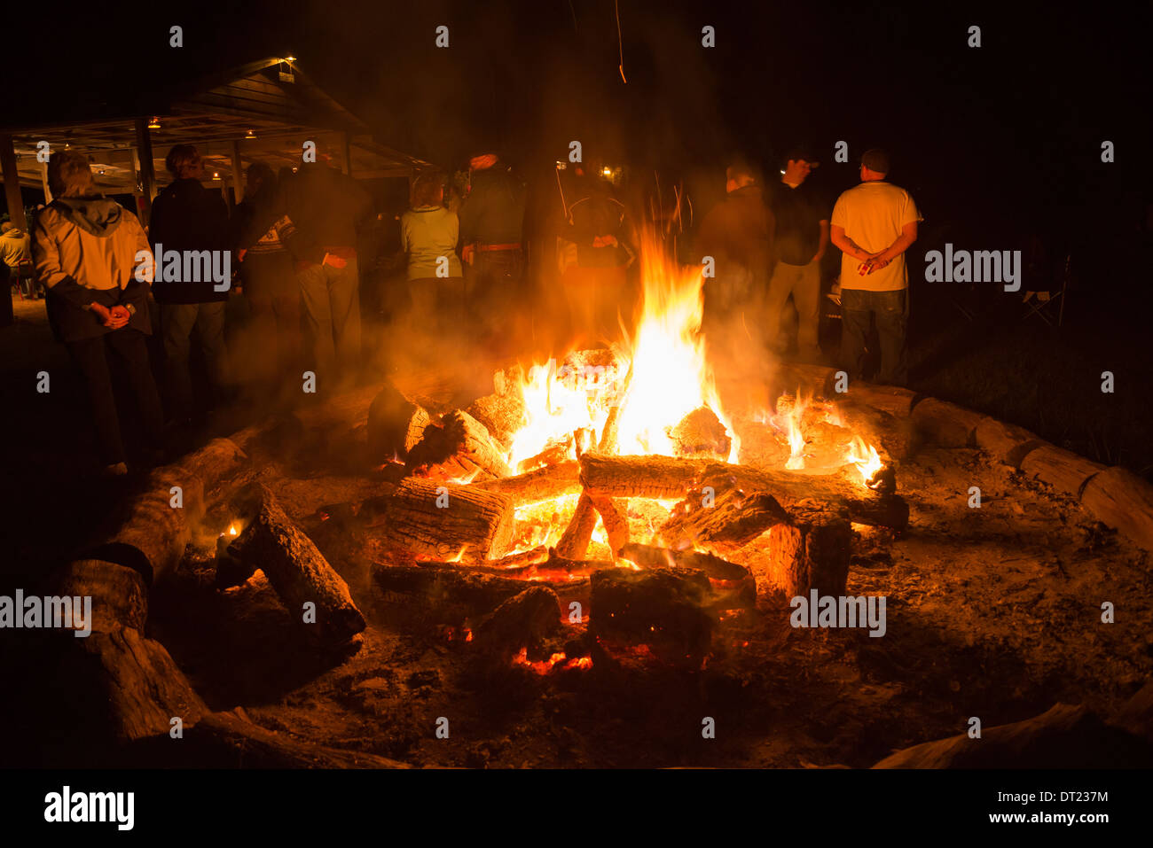 Family around fire at home hi-res stock photography and images - Alamy