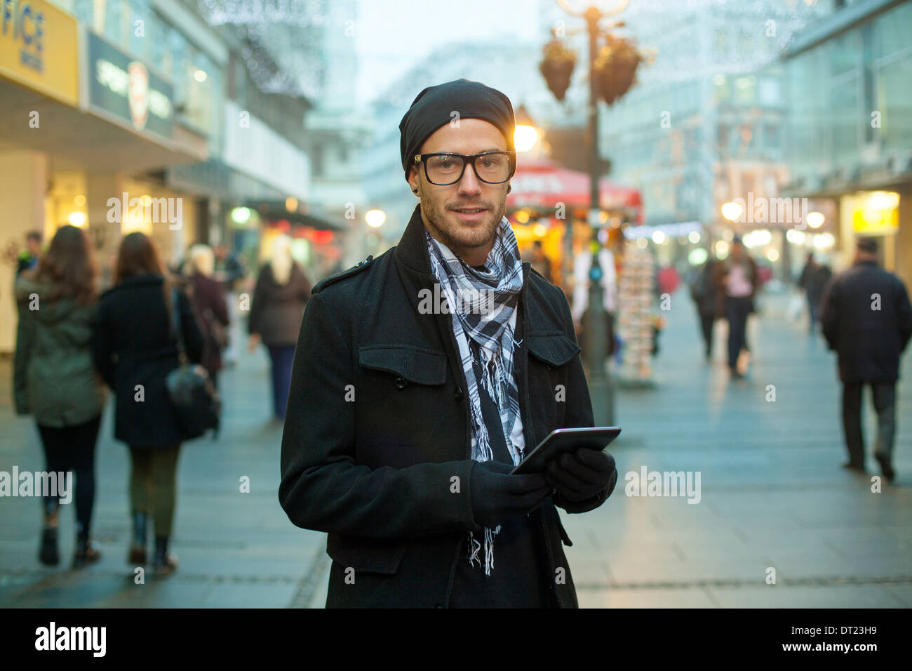 Young man searching information using an tablet computer Stock Photo ...