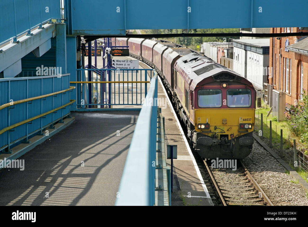 Class 66 diesel locomotive 66037 with train of loaded coal wagons ...