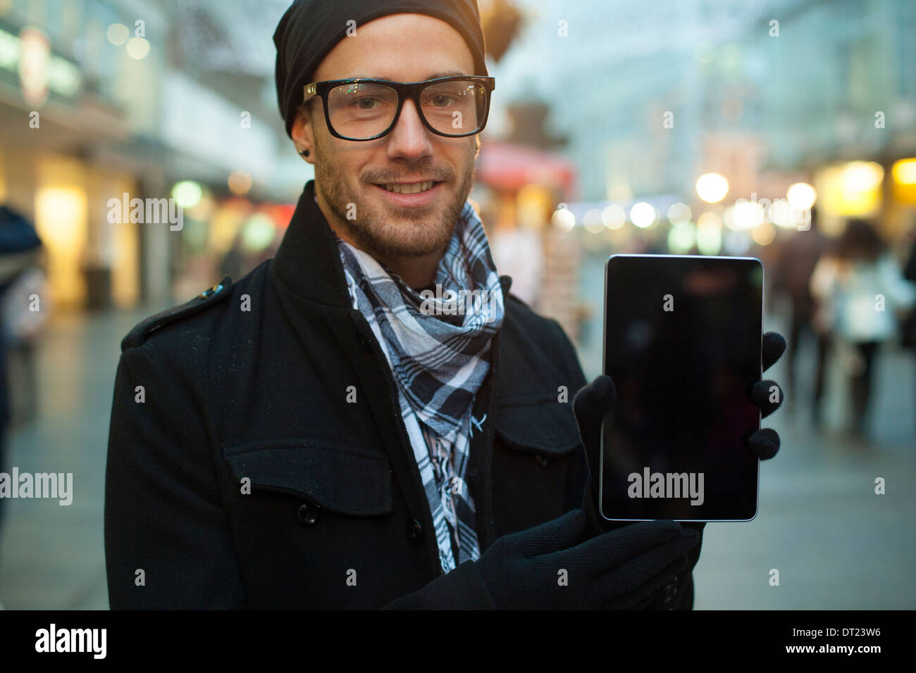 Young man searching information using an tablet computer Stock Photo ...