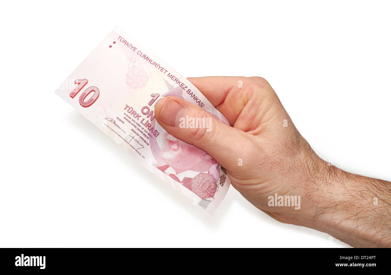 A hand holding a Turkish 10 Lira note, on a white background Stock ...