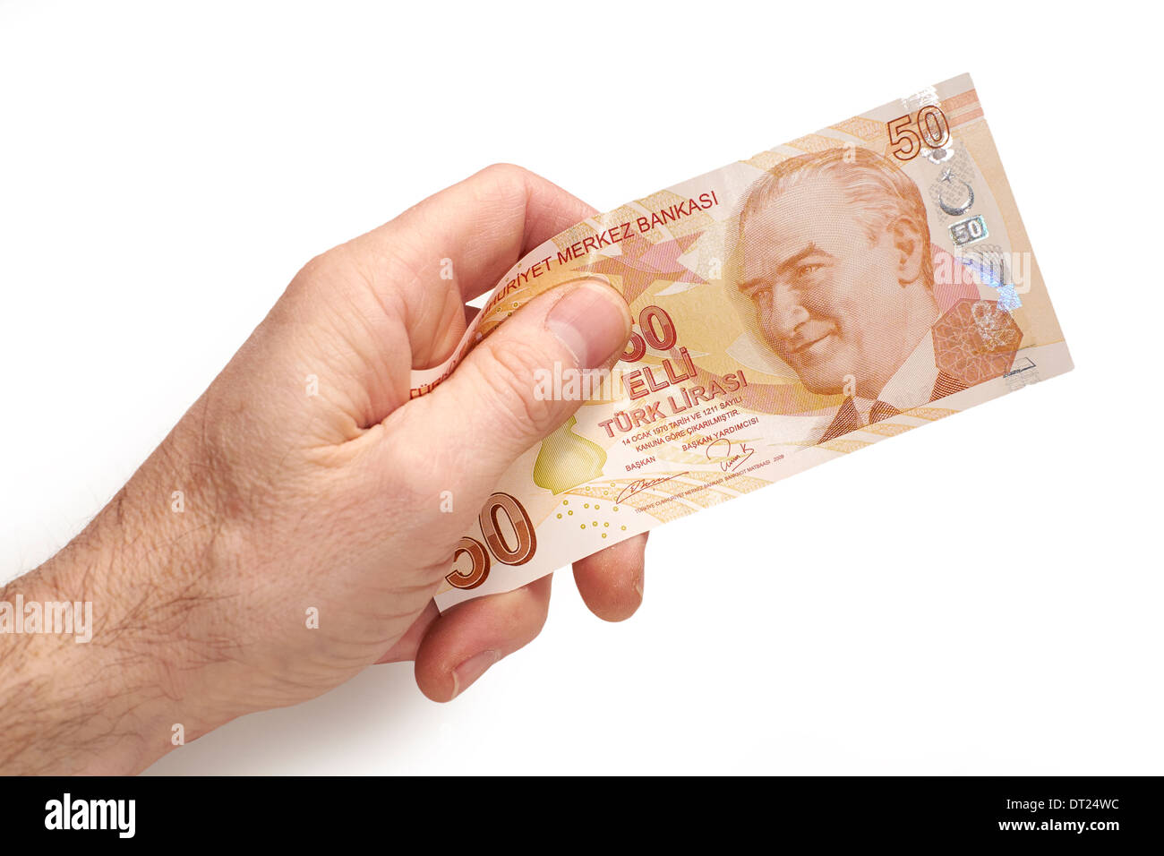 A hand holding a Turkish 50 Lira note, on a white background Stock ...