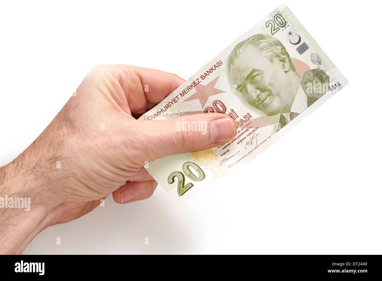 A hand holding a Turkish 20 Lira note, on a white background Stock ...