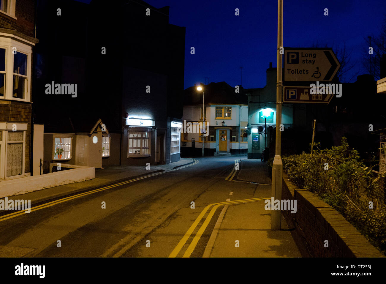shop small country street at night sign post Stock Photo - Alamy