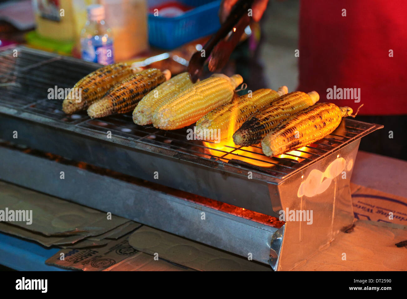 Barbecue maize at night market Stock Photo - Alamy