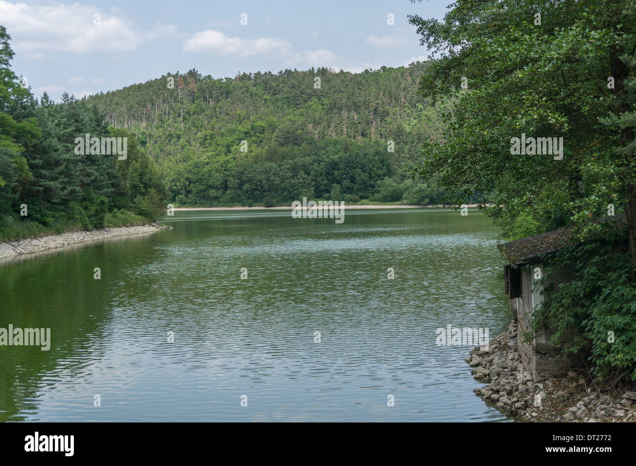 A view of a lake and waterfront with a shack on one of the shores Stock ...