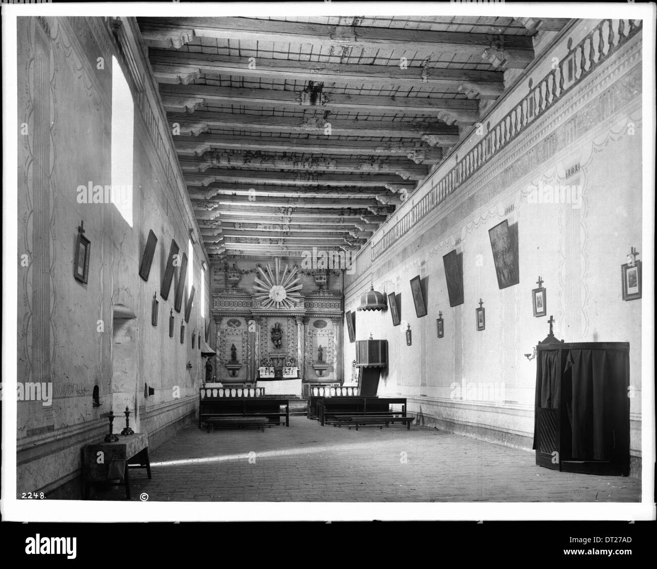This photograph shows the interior of Mission San Miguel Arcangel in ...