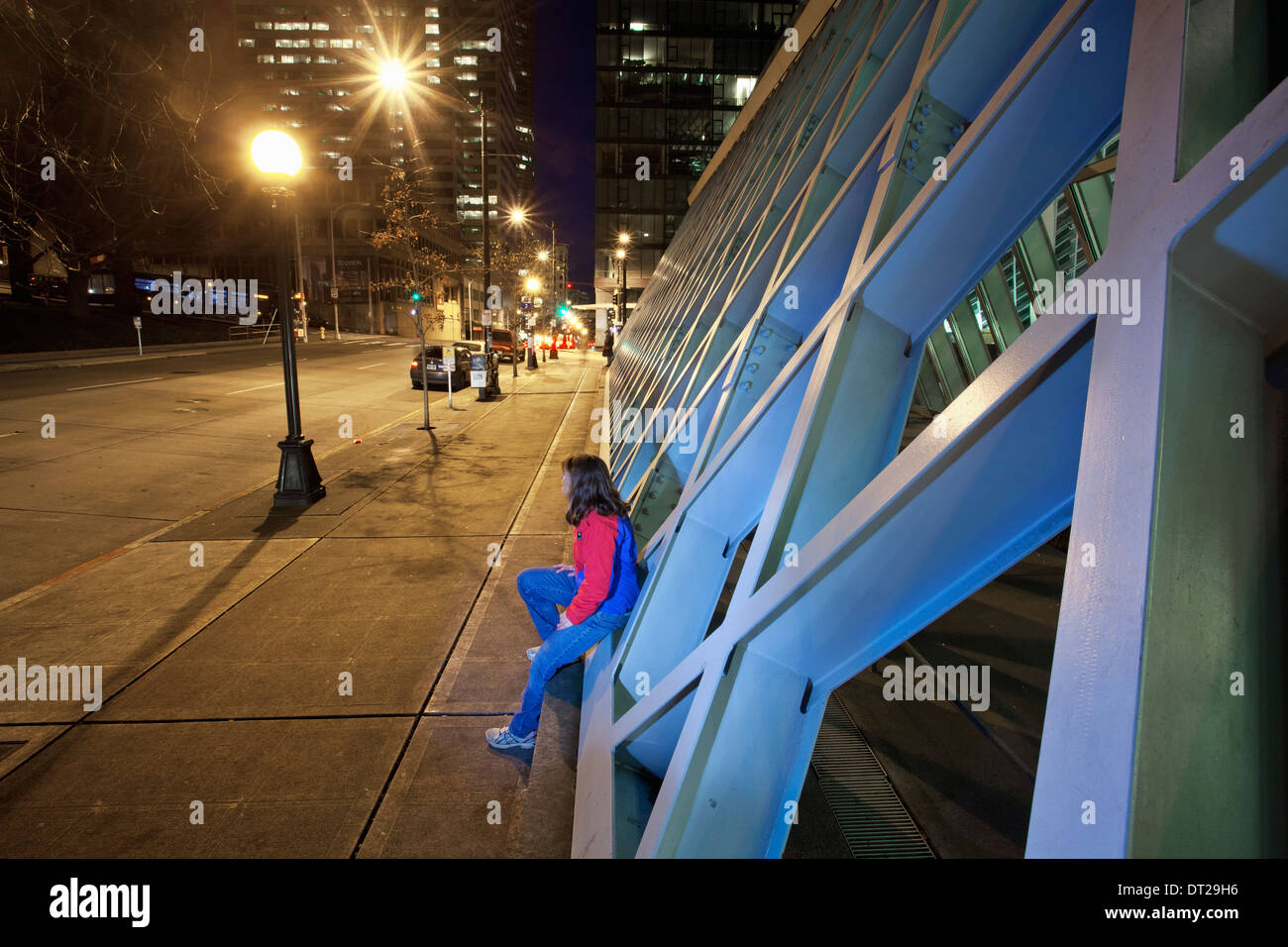 WASHINGTON - Night view of sidewalk on 5th Avenue next to the Seattle ...