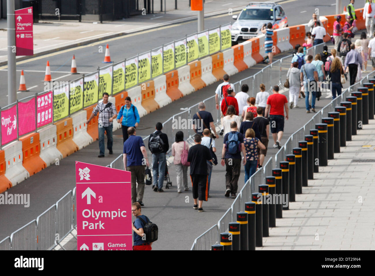 Ticket holders arrive to the Olympic Park on the first day of the 2012 ...