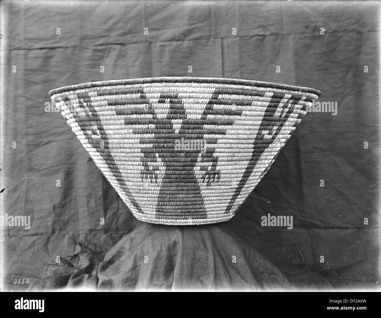 A photograph showing a large Pima Indian basket with an eagle design ...