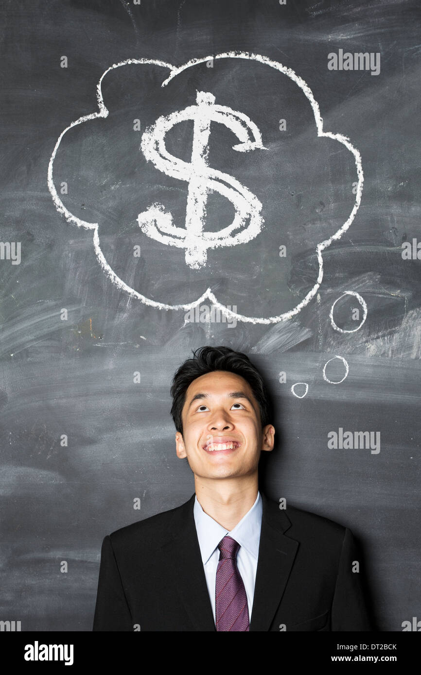 Portrait of an Asian business man thinking about money Stock Photo - Alamy