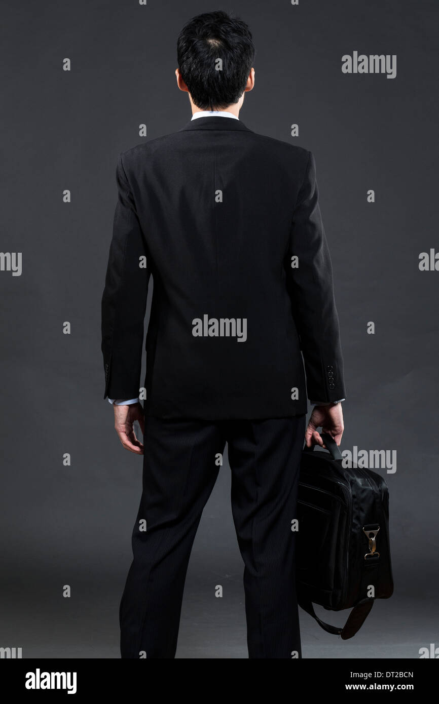 Back view of an Chinese business man Stock Photo - Alamy