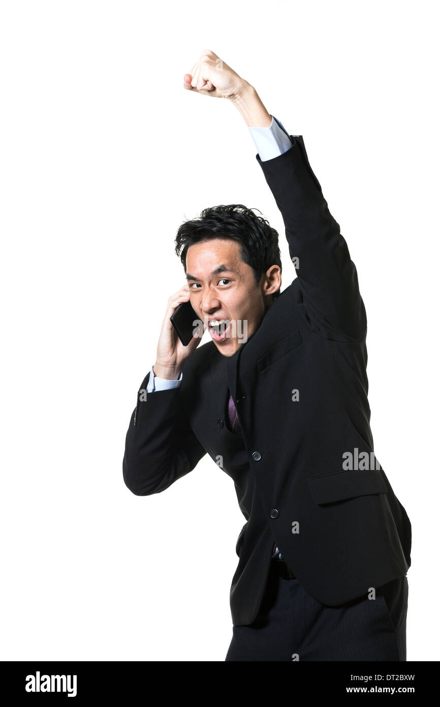 Portrait of a successful Chinese businessman celebrating. Isolated on a ...