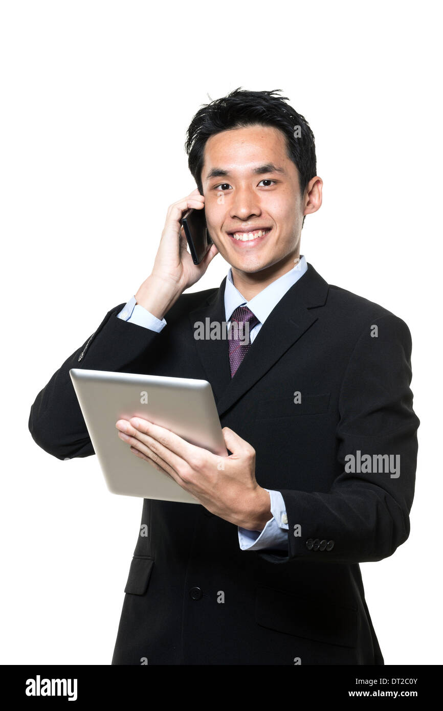 Chinese businessman with a tablet computer. Isolated on a white ...