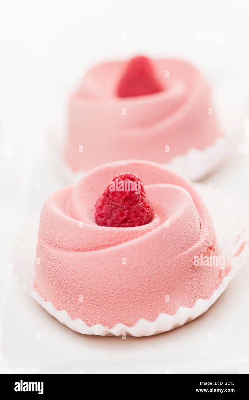 Closeup of two pink raspberry mousse desserts Stock Photo - Alamy