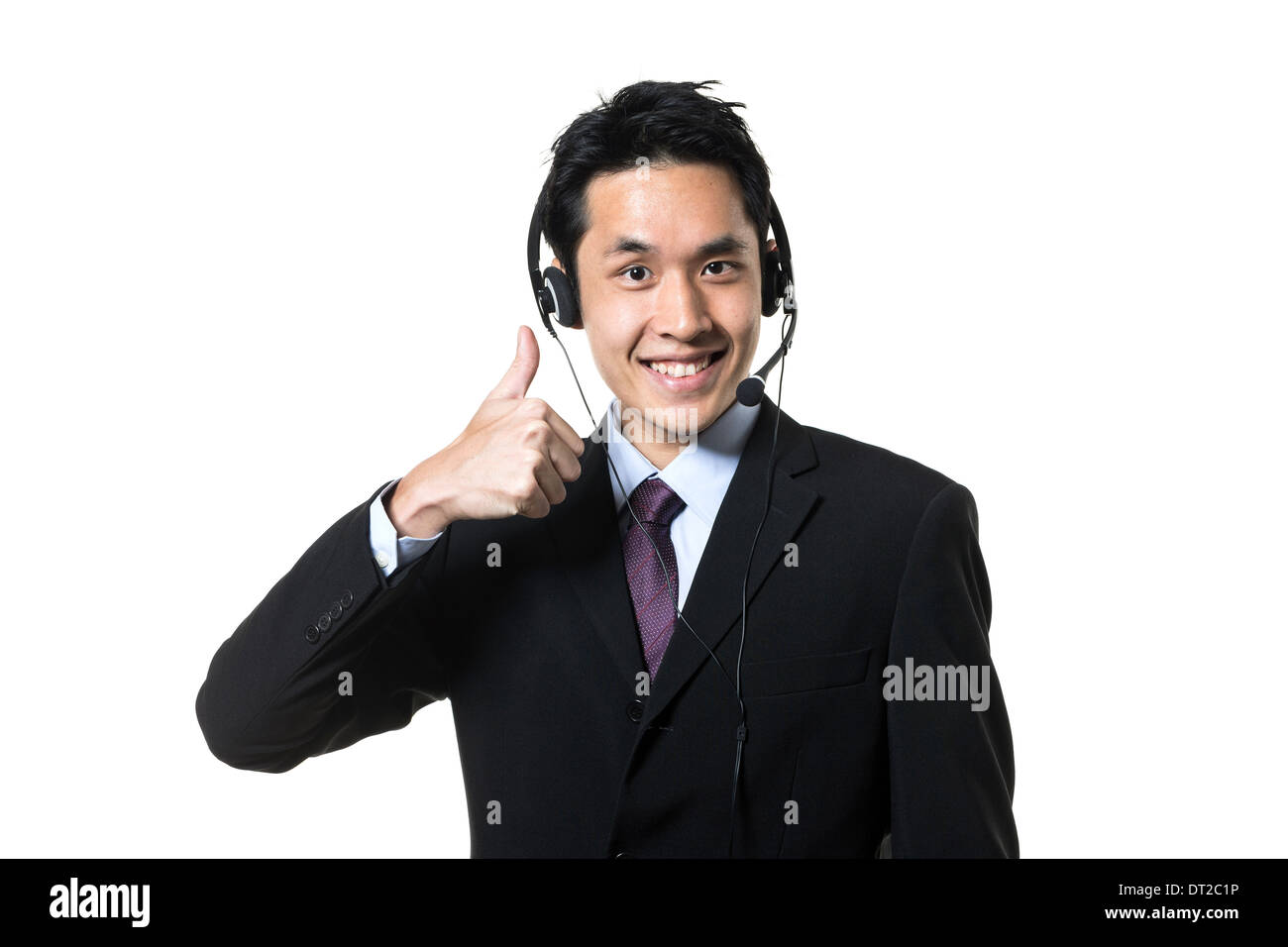 Chinese businessman, call-center agent wearing a headset. Isolated on a ...