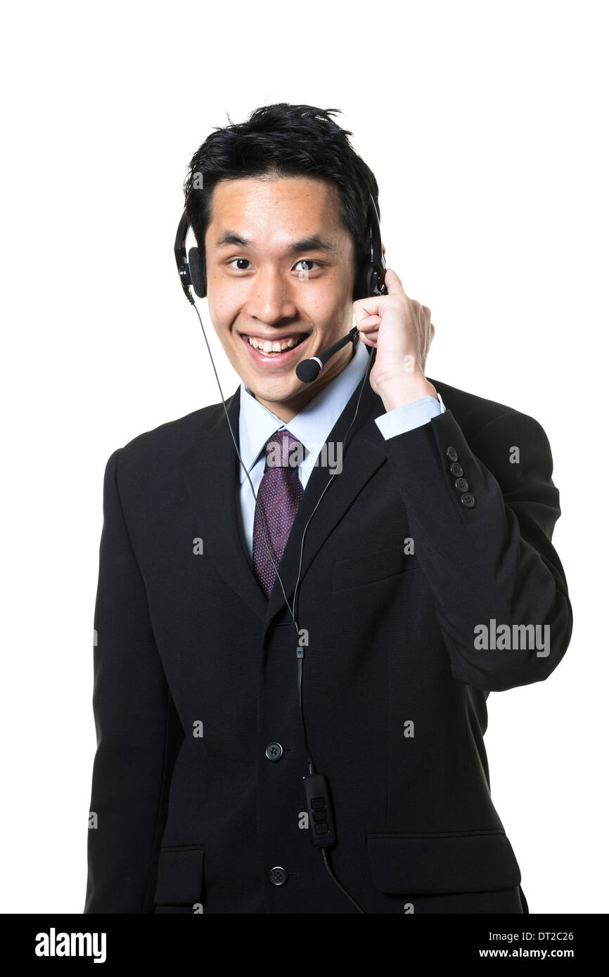 Chinese businessman, call-center agent wearing a headset. Isolated on a ...