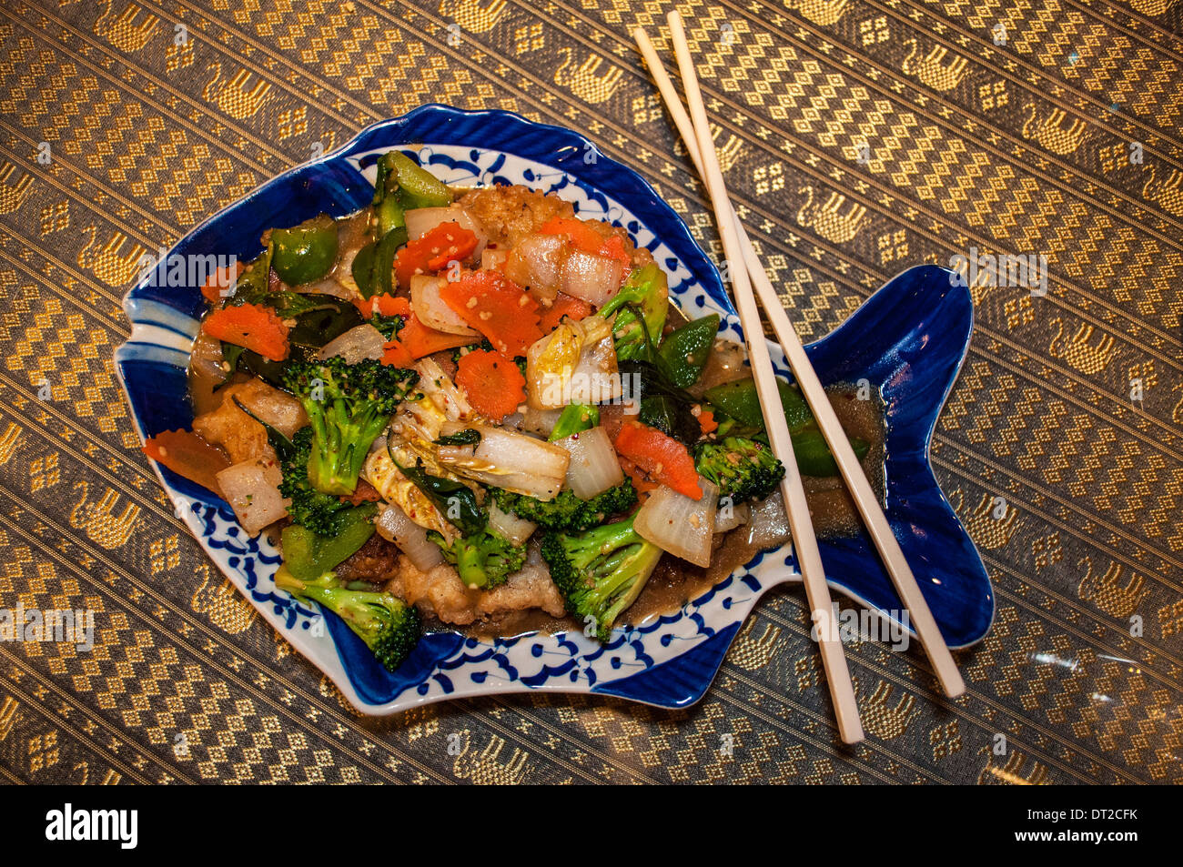Thai-style fish and veggies in a colourful melange served on a stylish ...
