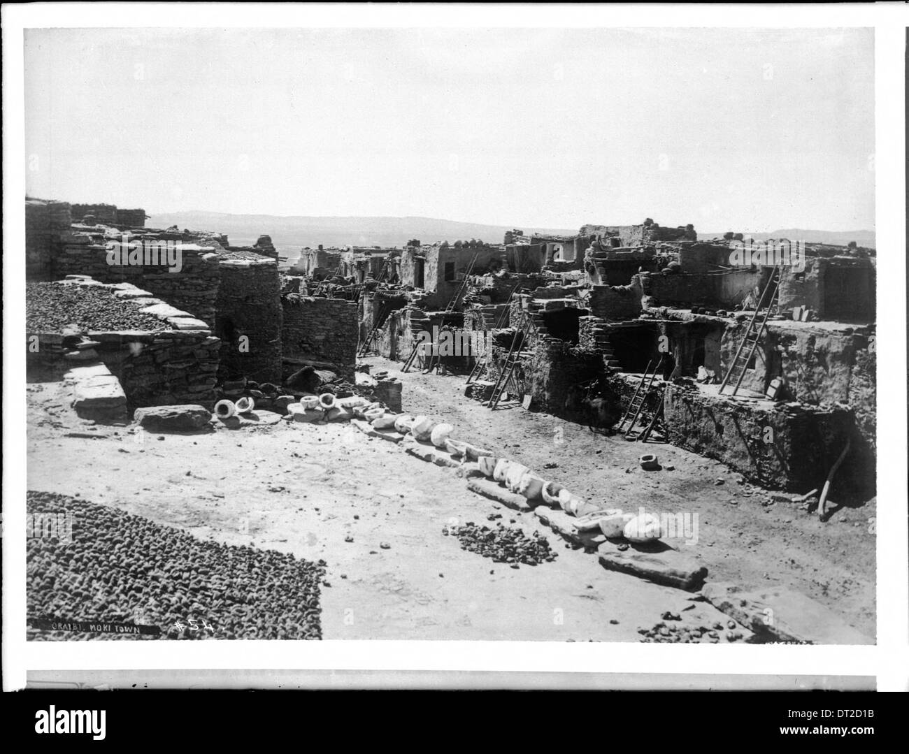 A low oblique aerial view captures a street in the Hopi pueblo of ...
