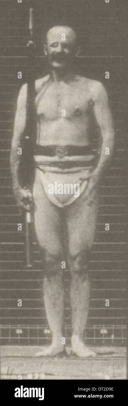 A photograph of a man in a pelvis cloth, preparing to position a ...