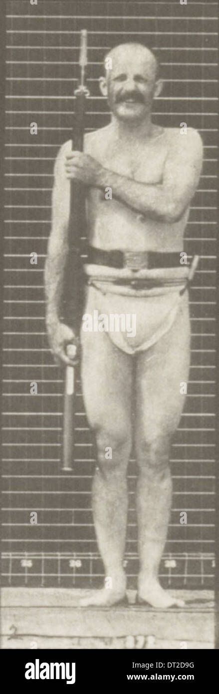 A photograph of a man in a pelvis cloth, preparing to position a ...