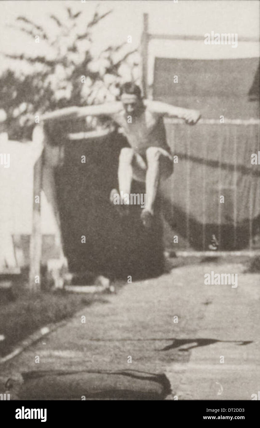 A man in a pelvis cloth is captured running and jumping, demonstrating ...