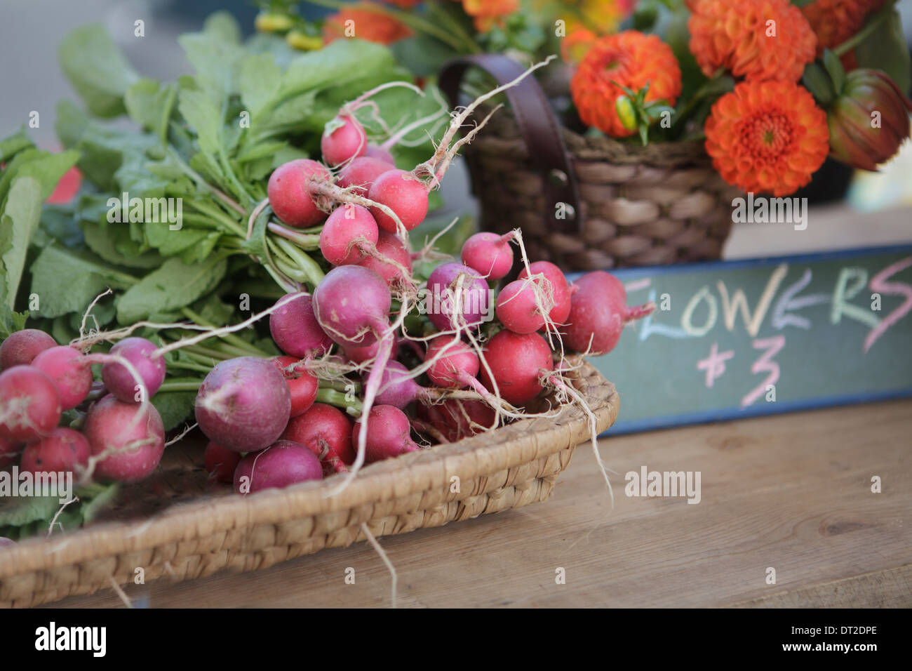 Radishes displayed in a basket at a Market Stock Photo - Alamy