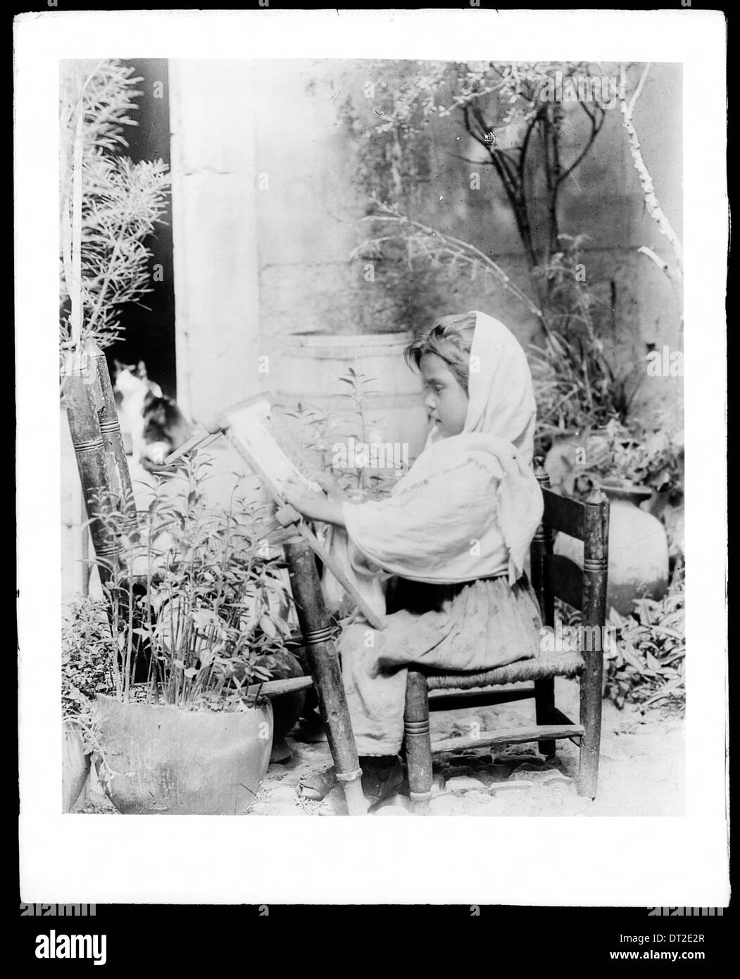 Mexican child at needlework (drawn work), Agua Caliente, Mexico, ca ...