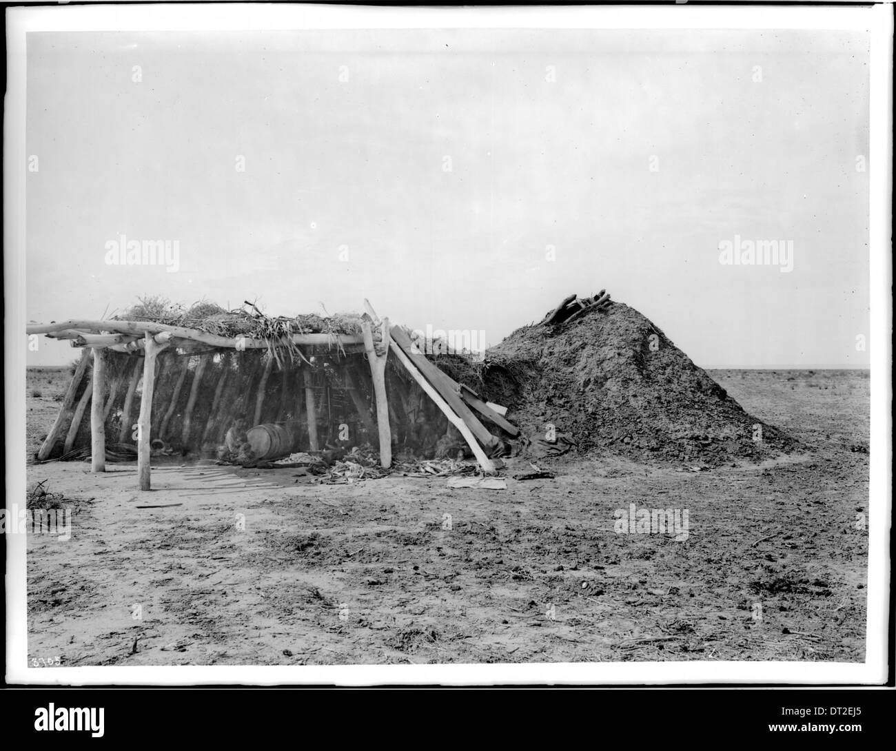 A Navajo Indian hogan with a ramada, photographed around 1900. The ...
