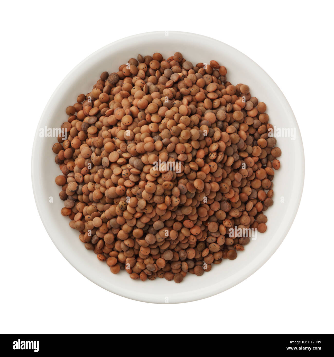 Uncooked lentils in a bowl isolated on white background Stock Photo - Alamy