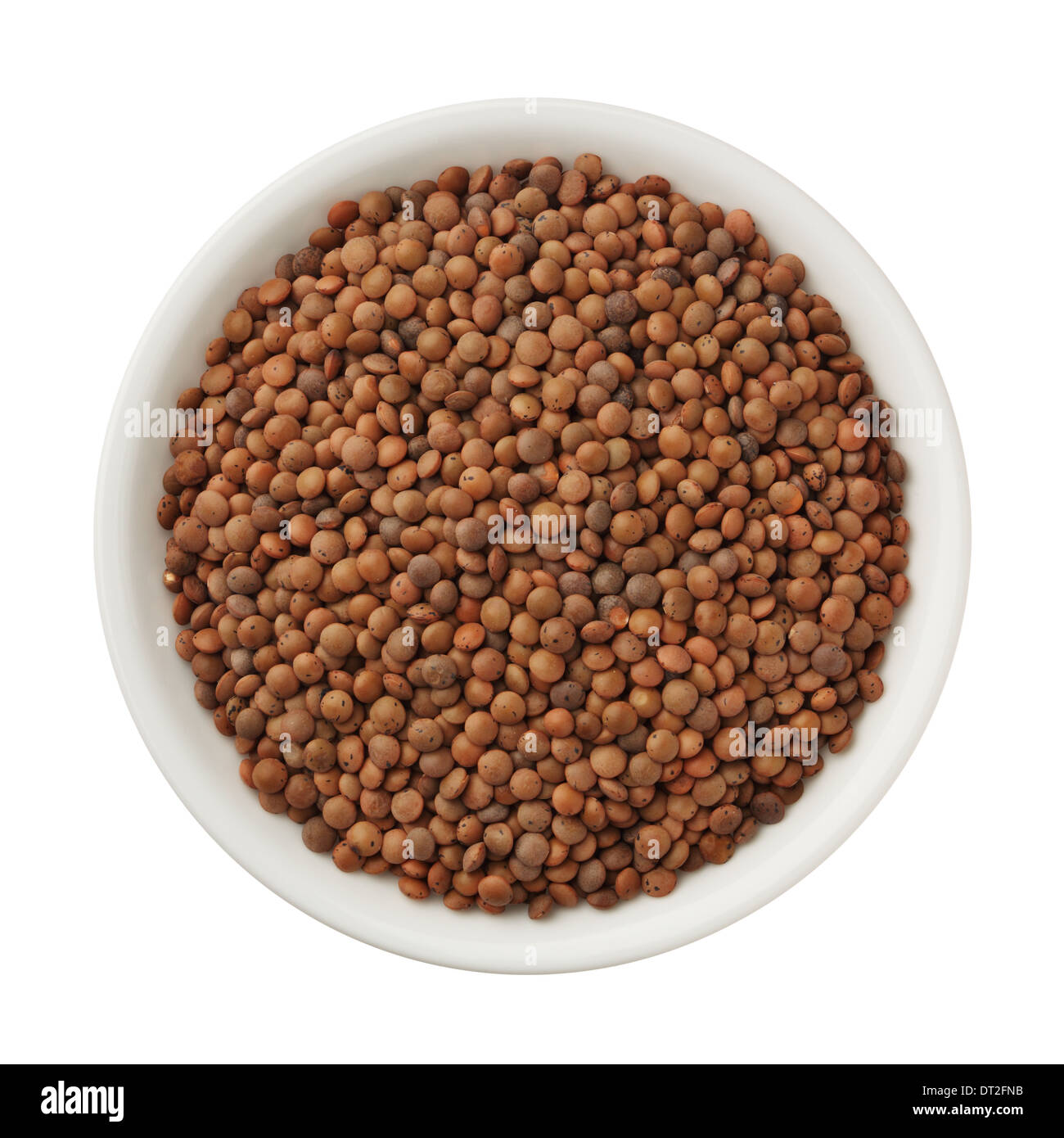 Uncooked lentils in a bowl isolated on white background Stock Photo - Alamy