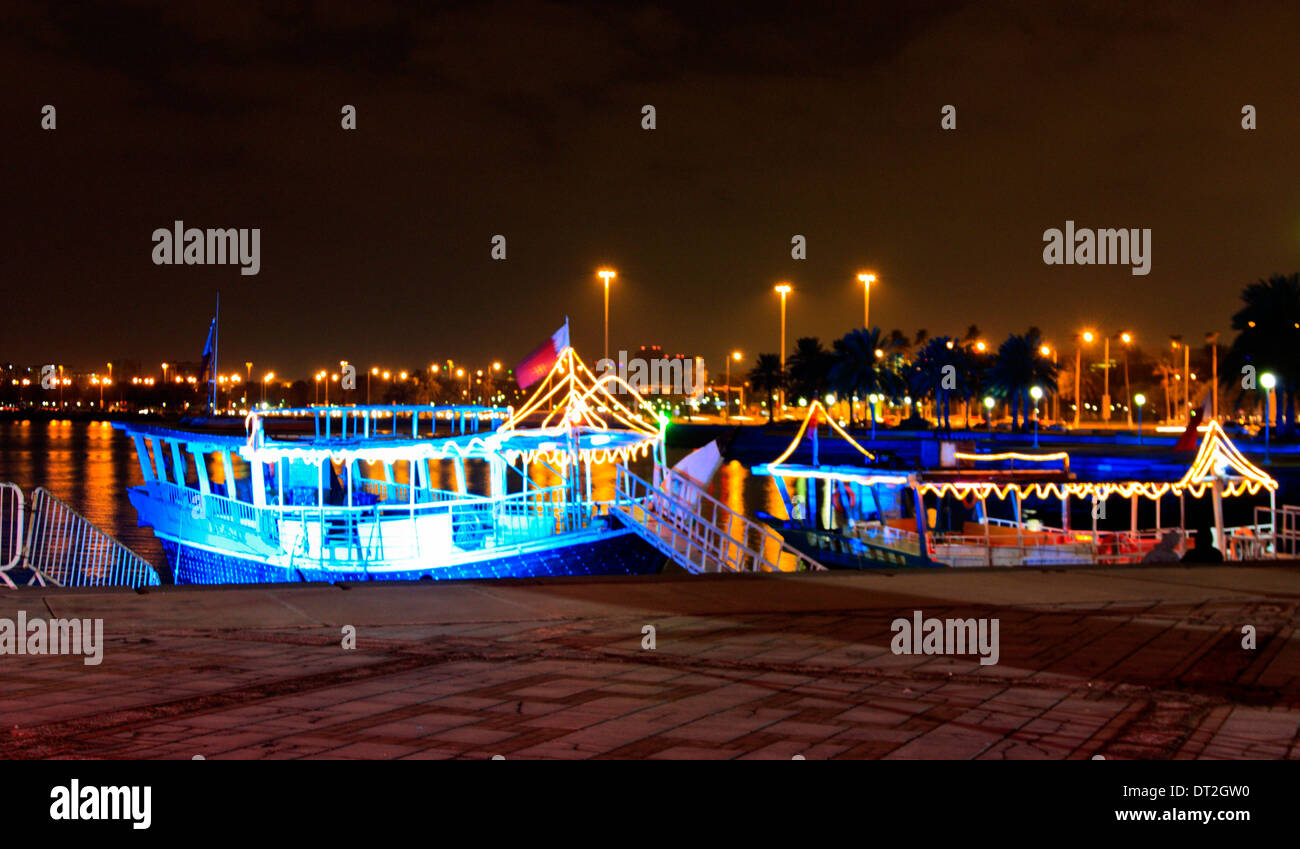 Tourist Cruise Boats at the Corniche Promenade at night, Doha, Qatar ...