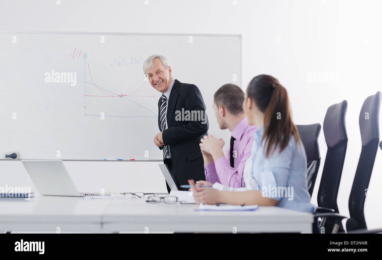 Senior business man giving a presentation Stock Photo - Alamy
