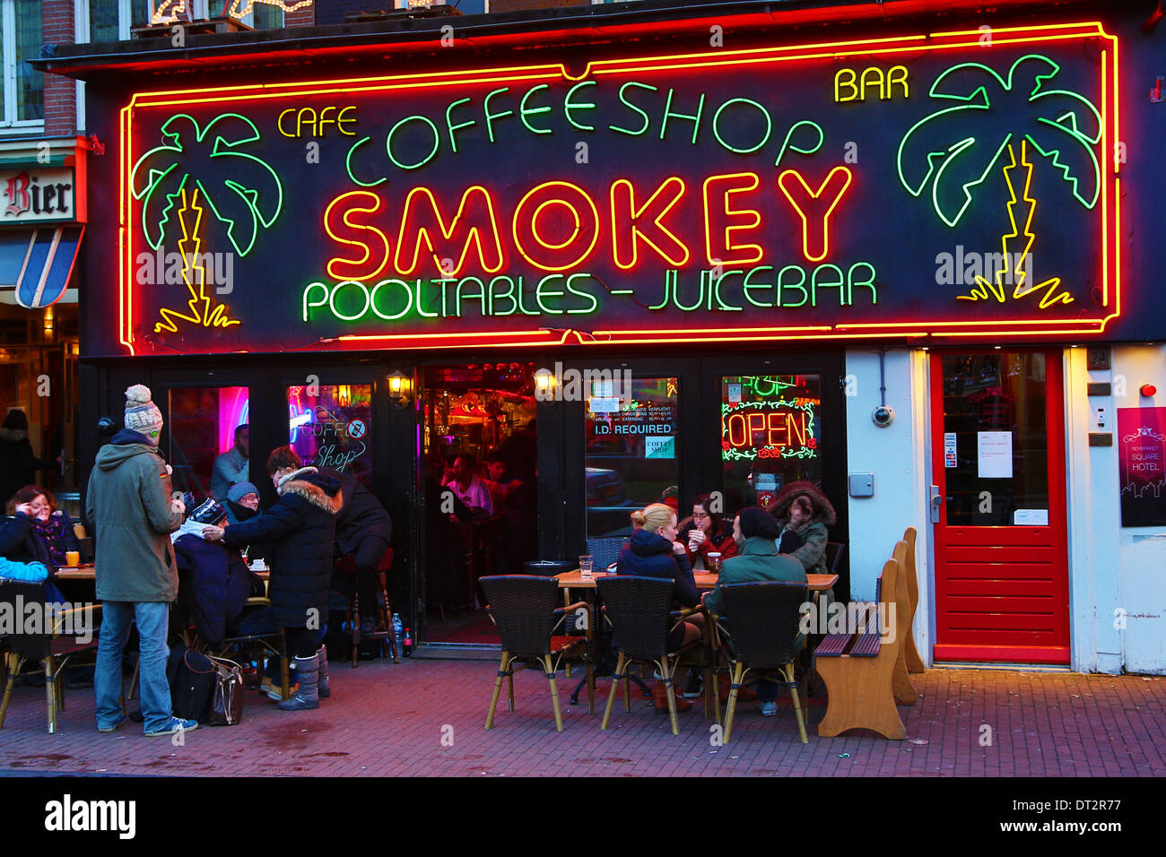 Neon lights on the sign of the Smokey Coffeeshop where taking and ...