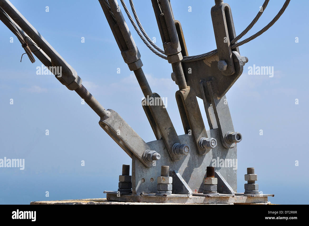 Metal sling held electricity mast Stock Photo - Alamy