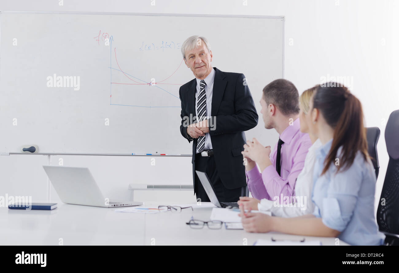 Senior business man giving a presentation Stock Photo - Alamy