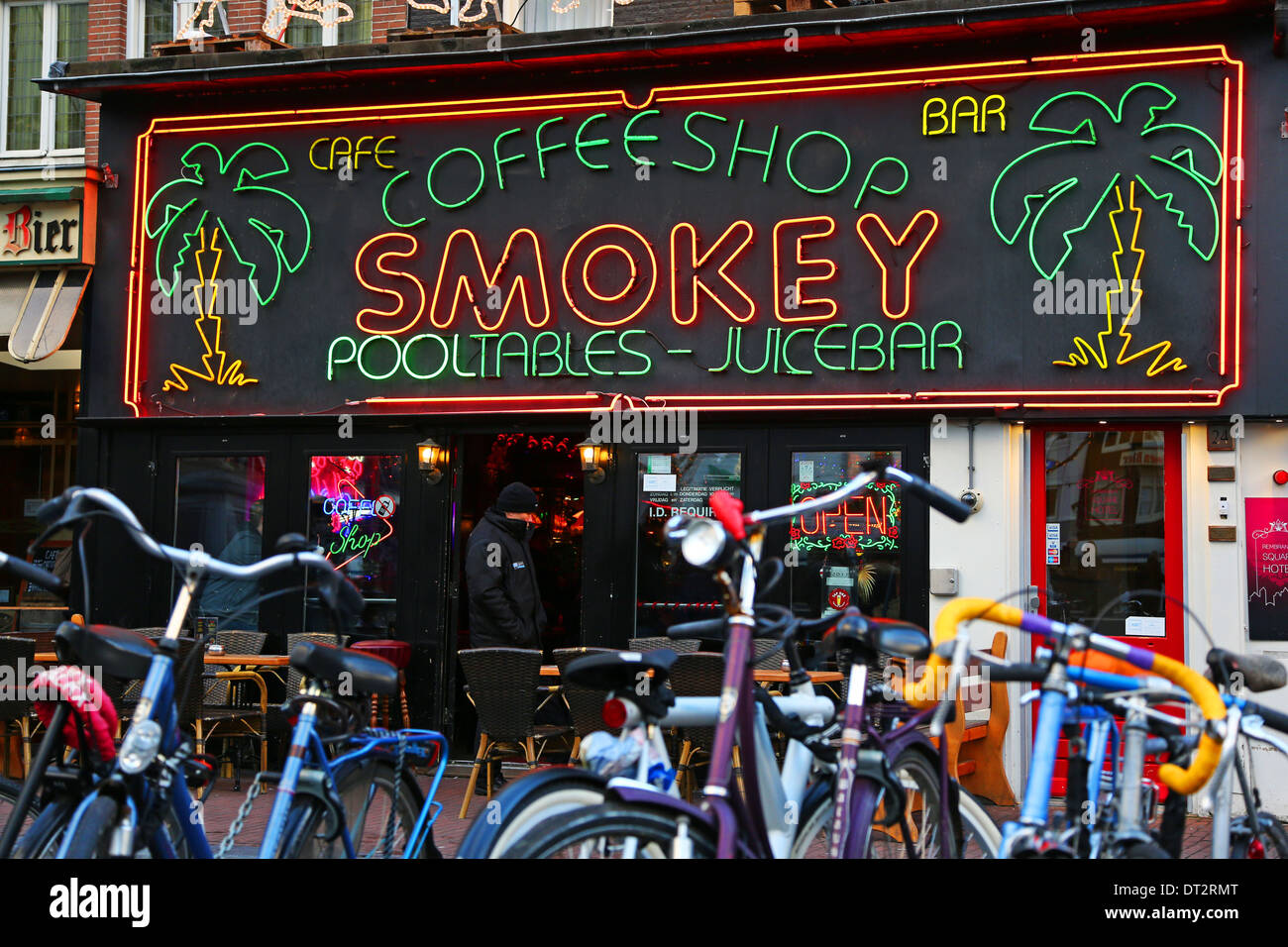Neon lights on the sign of the Smokey Coffeeshop where taking and ...