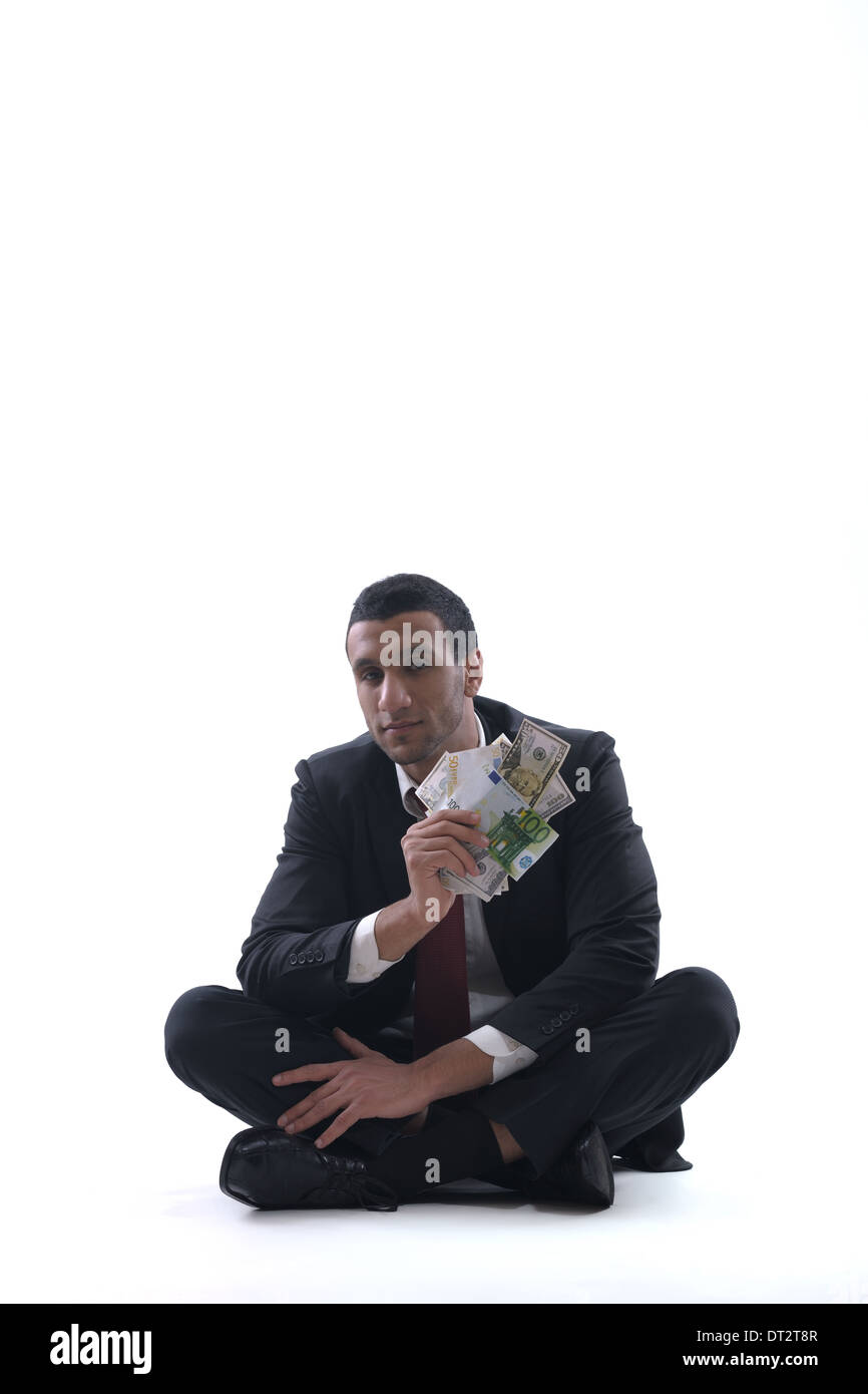 Business man holding money Stock Photo - Alamy