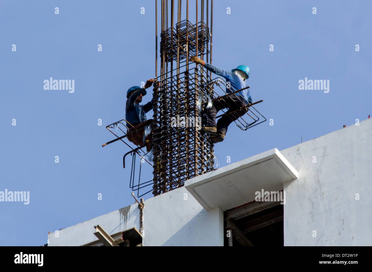 Metro Manila, Philippines: February 7, 2014 -Workers check the steel ...