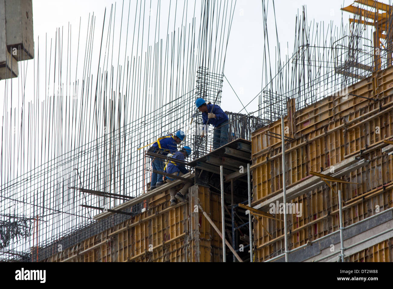 Metro Manila, Philippines: February 7, 2014 -Workers check the steel ...