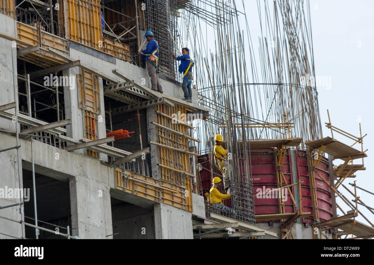 Metro Manila, Philippines: February 7, 2014 -Workers check the steel ...